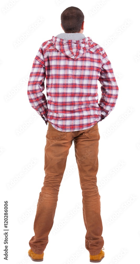 Back view of guy in a plaid shirt with hood looking. Standing young guy ...