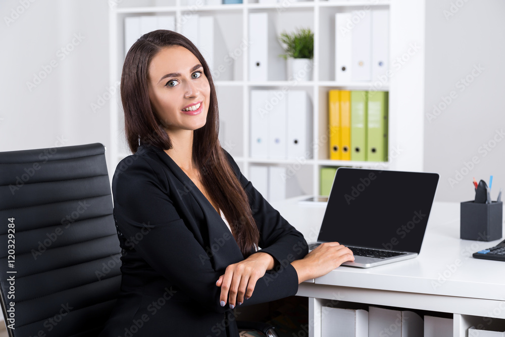 Smiling lady with long hair in office Stock Photo | Adobe Stock
