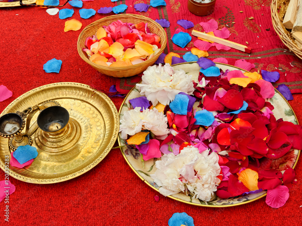 Flower petals and sacred flames on hindu wedding in the Vedic tradition ...