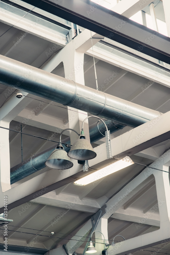 Industrial interior details: ceiling beams and pipes on factory, loft ...