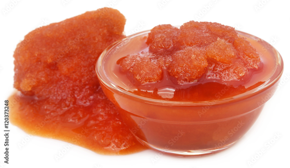 Molasses in a glass bowl over white background Stock Photo | Adobe Stock