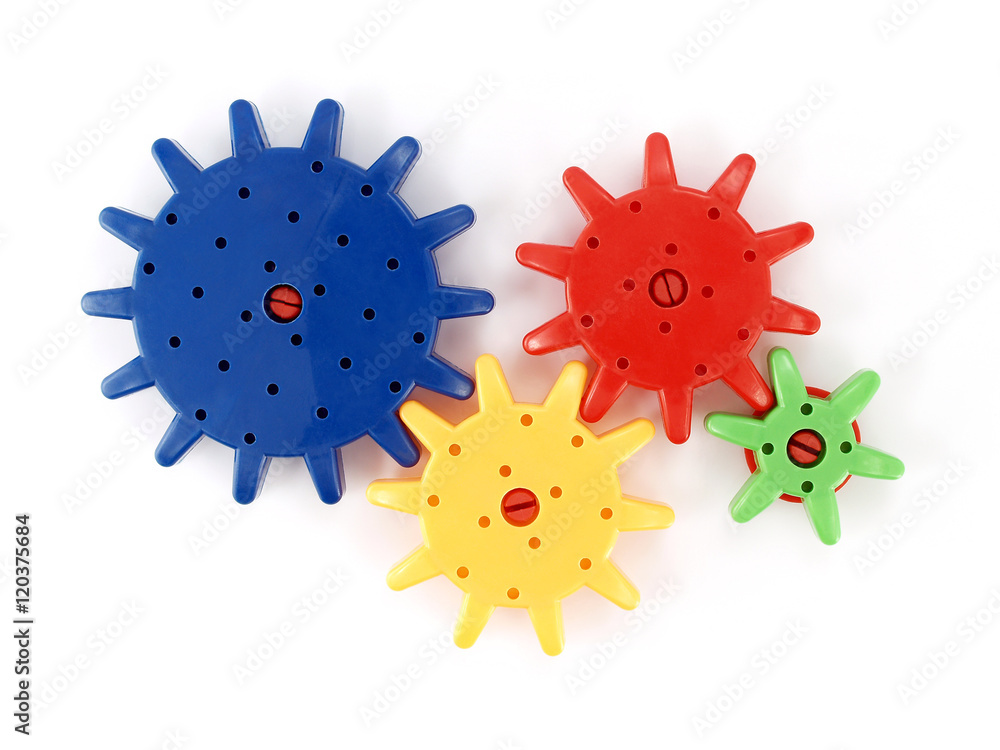 many sizes of colorful plastic gear wheels (blue yellow red green color ...