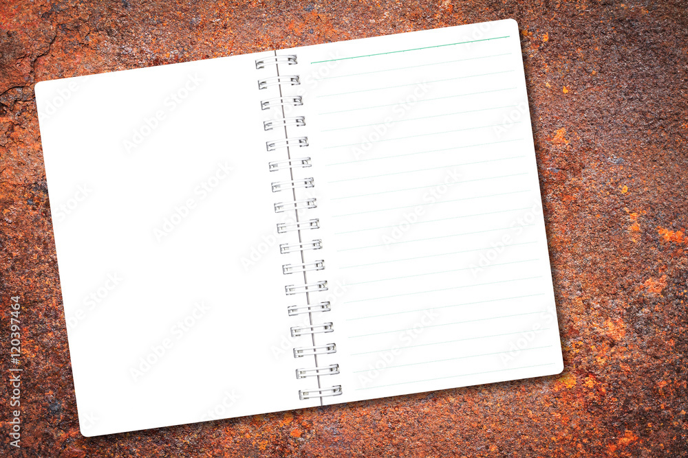 Open notebook paper page with green line on rusty metal background for ...