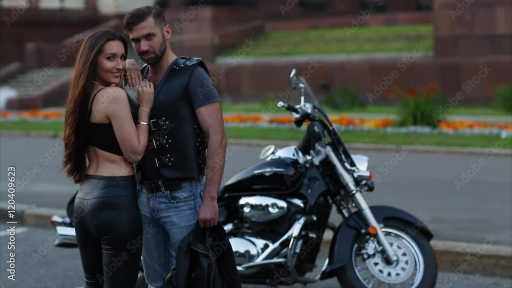 Couple in Love Hugging and Flirting in Front of His Motorcycle Stock ...