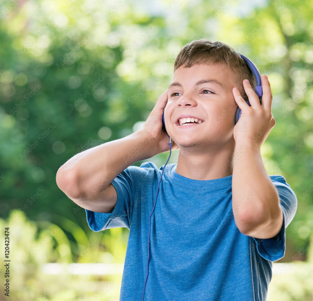 Teen boy with headphones Stock Photo | Adobe Stock