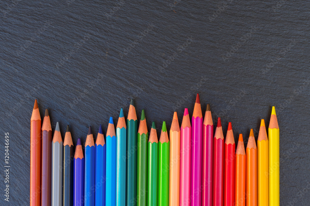 Back to school pencils color rainbow border on black board background ...