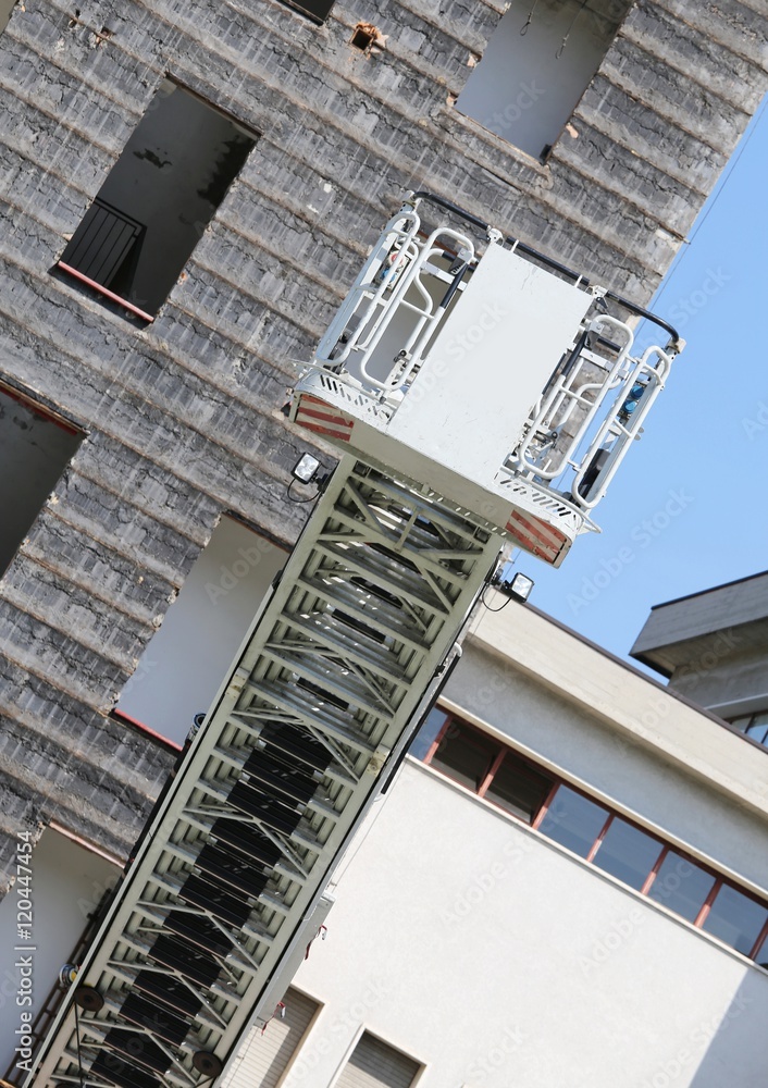 elevator cage of fire truck with big ladder of firemen Stock Photo ...