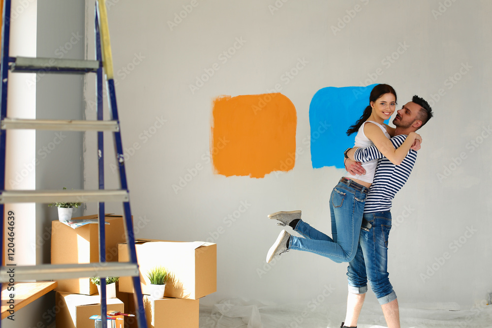 Portrait of a cute young couple into their new home Stock Photo | Adobe ...