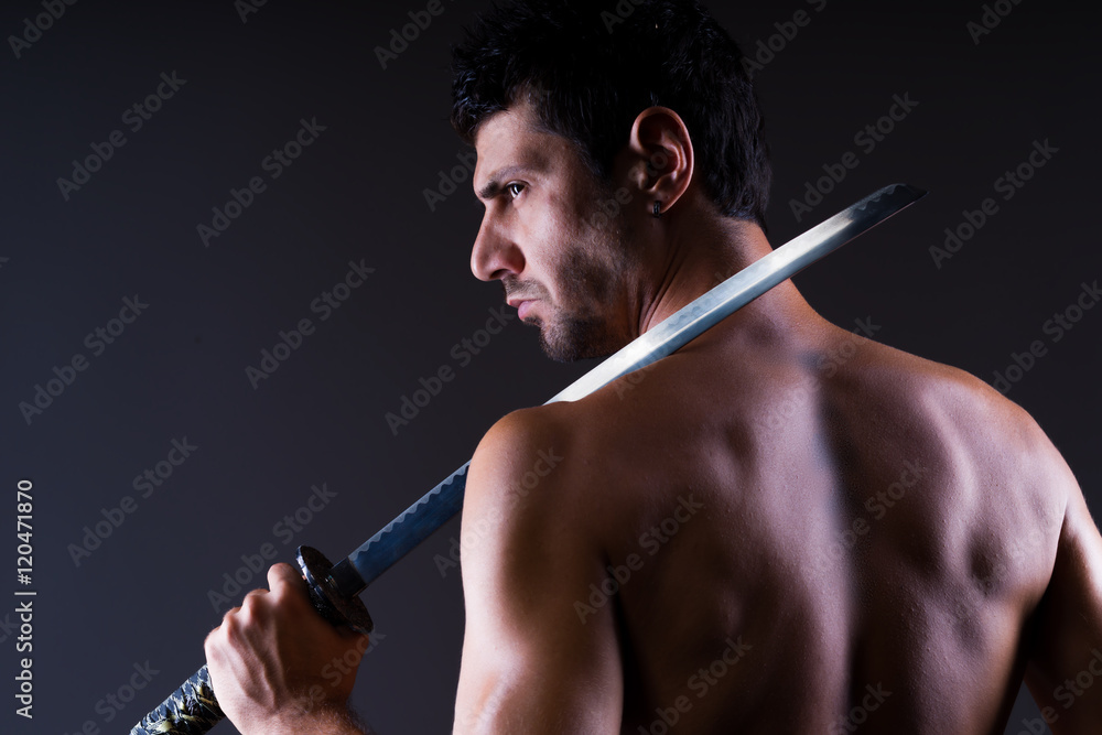 shirtless young man posing with katana Stock Photo | Adobe Stock