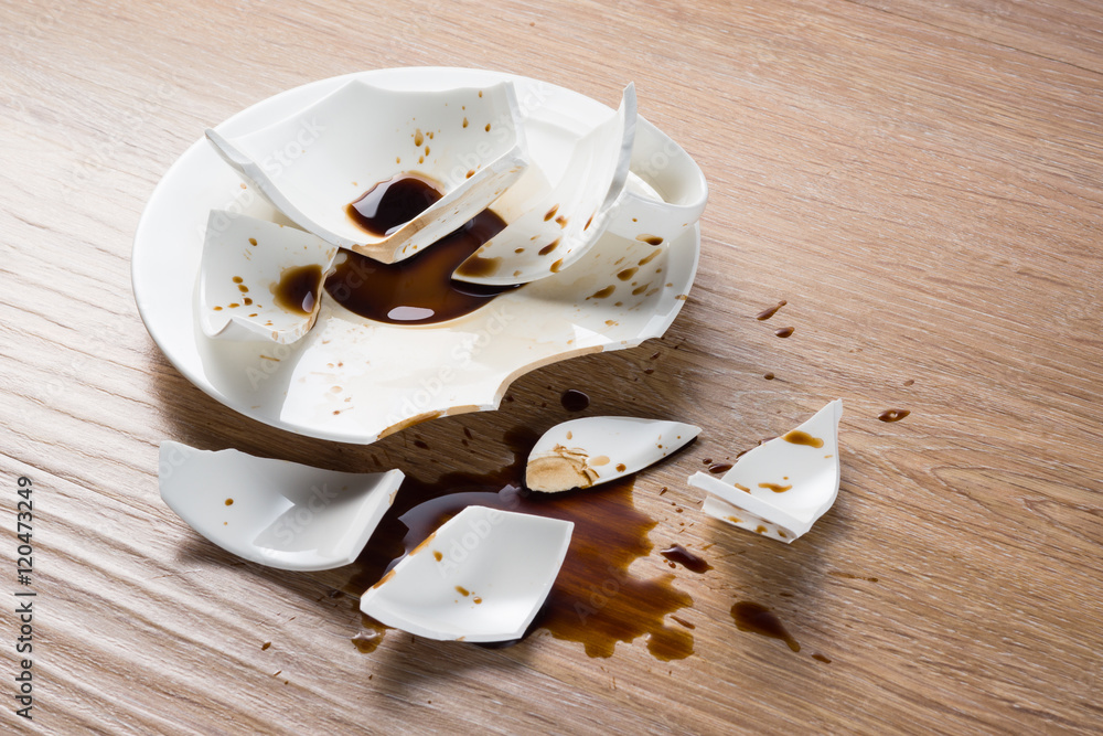 broken white coffee cup with splash on wood floor Stock Photo | Adobe Stock