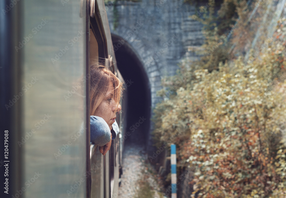 Foto Stock Depressed young woman in the train | Adobe Stock