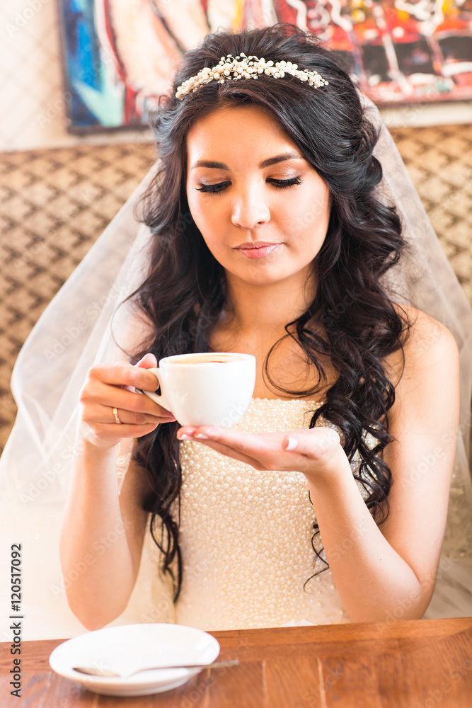Bride drinking coffee at a wedding day Stock Photo | Adobe Stock