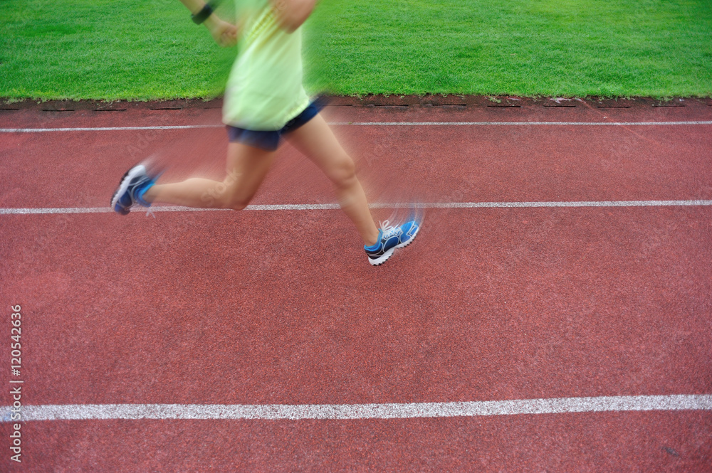 woman runner legs running on red track in stadium Stock Photo | Adobe Stock