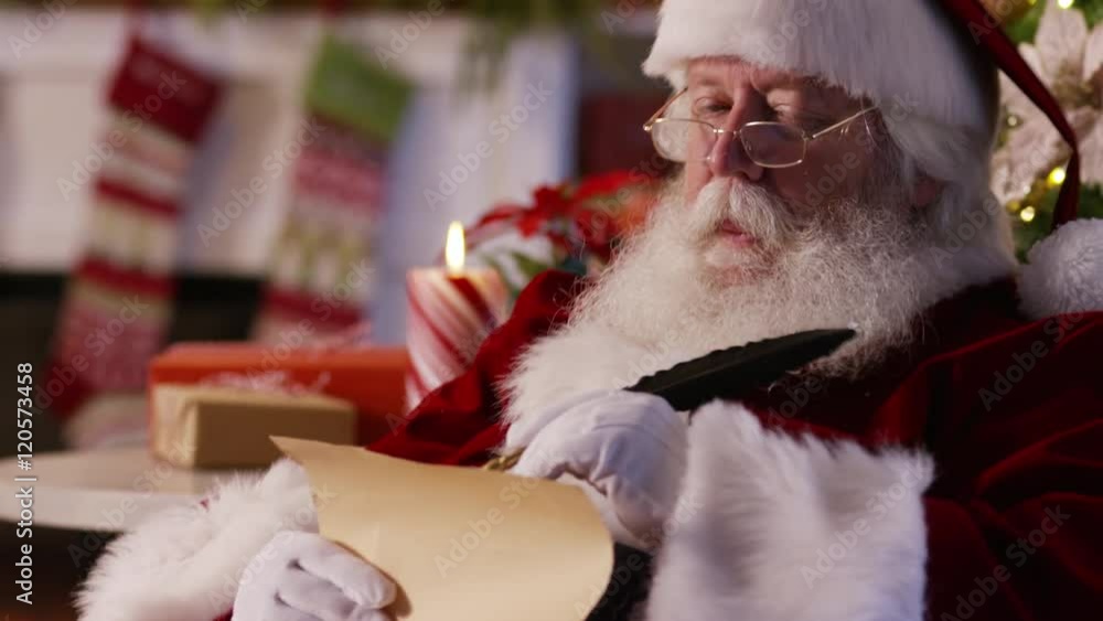 Portrait of Santa Claus writing on list Stock Video | Adobe Stock