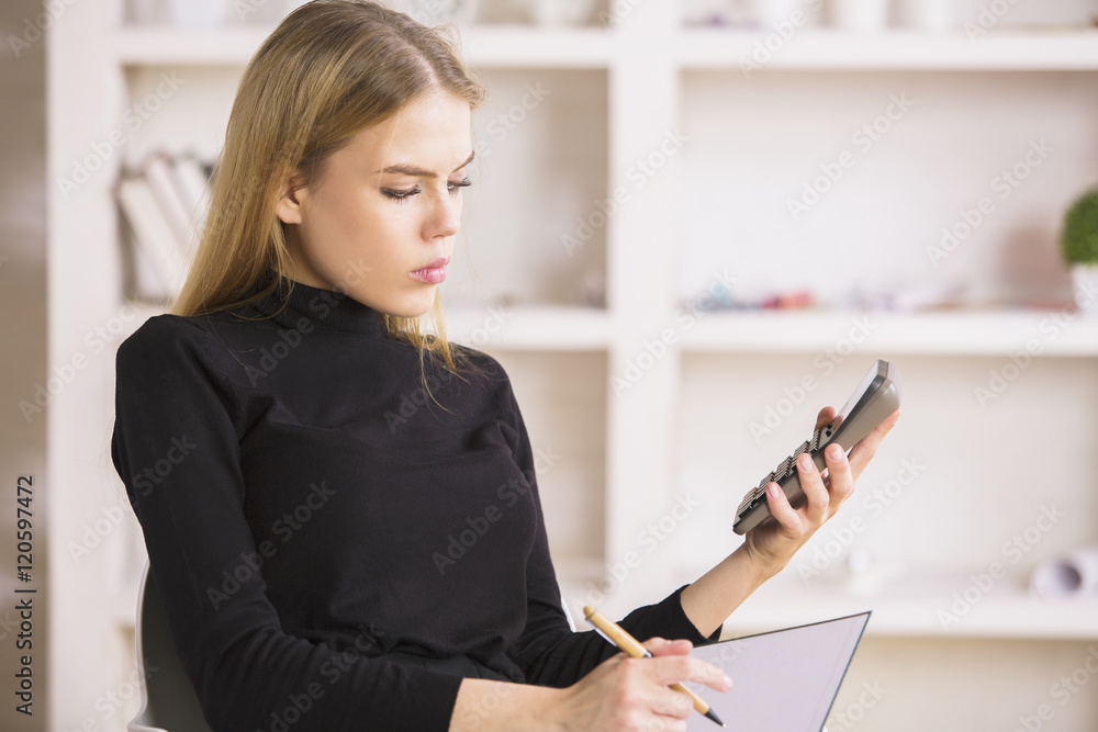 Pretty female accountant at work Stock Photo | Adobe Stock