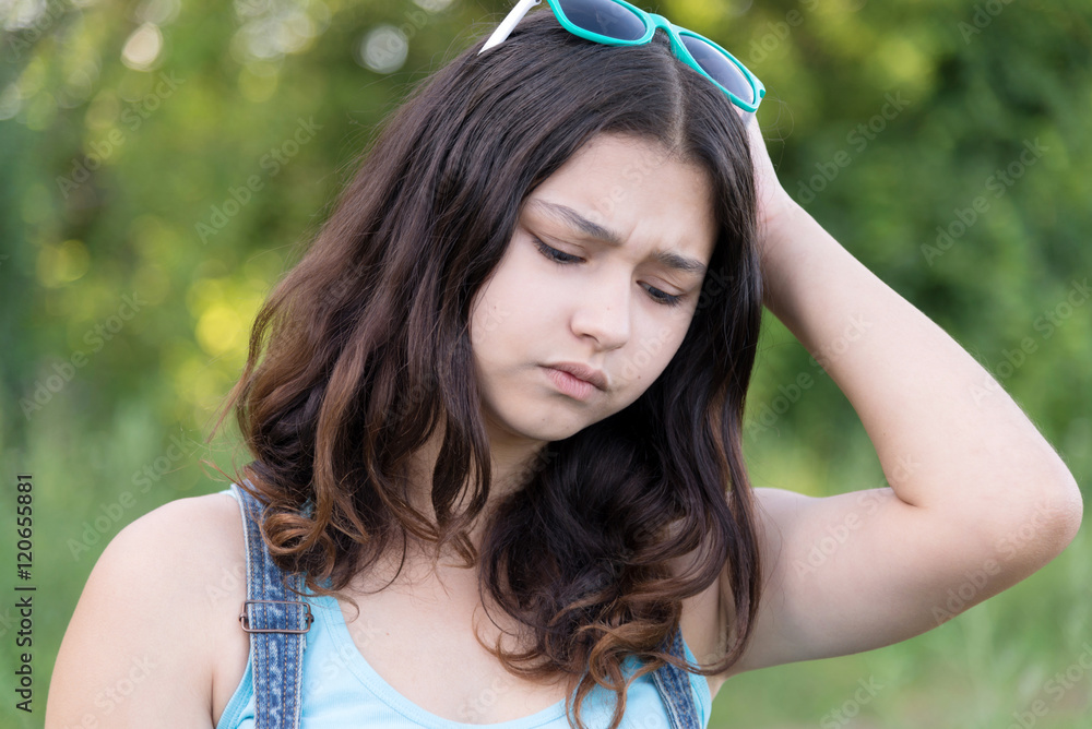 Portrait of teen girl busy problems in summer nature Stock Photo ...