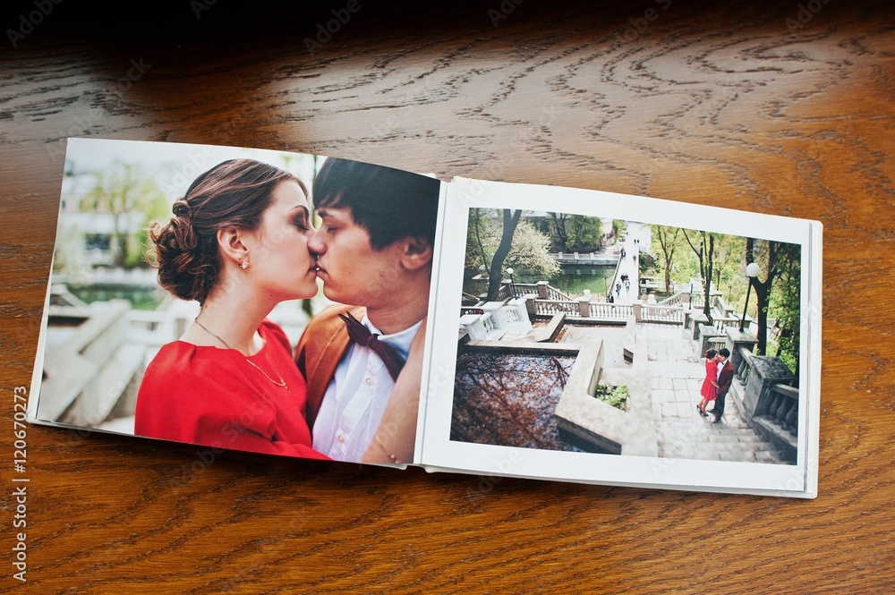 Open pages of album photobook couple in love on wooden background Stock ...
