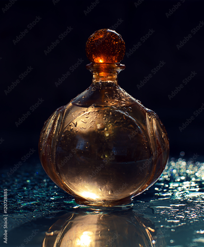 Perfume bottle with water drops Stock Photo | Adobe Stock