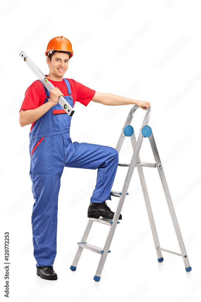 Construction worker posing on a ladder Stock Photo | Adobe Stock