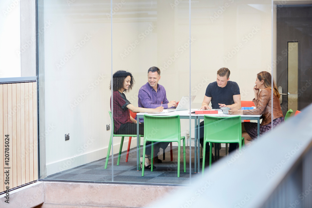 Design team meeting at design studio boardroom table Stock Photo ...