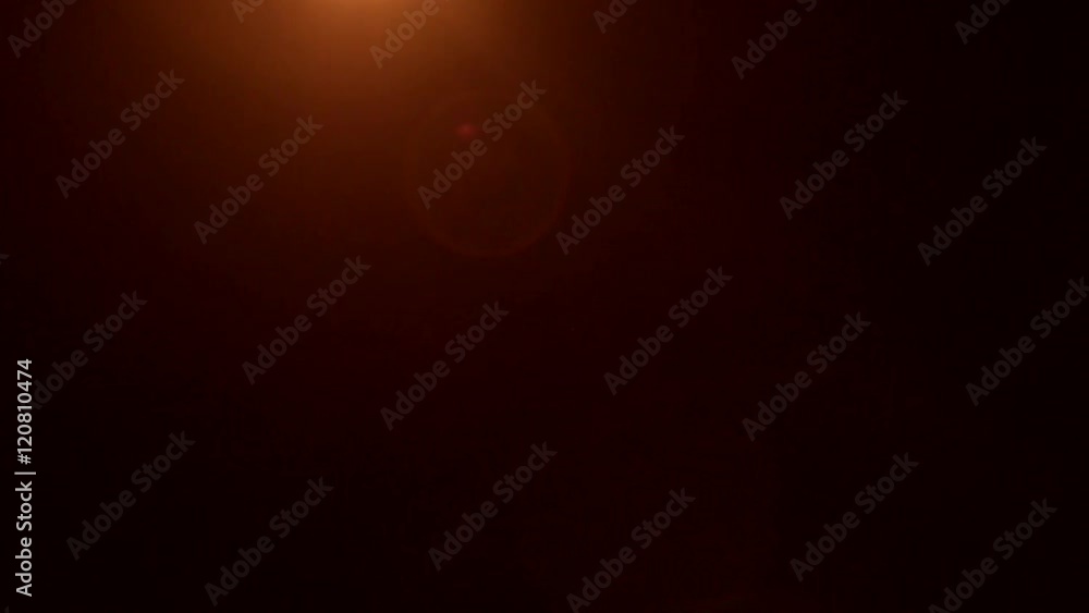 Lens flare overlay background 4k. Real light leak effect. Red orange black light blur fire or ...