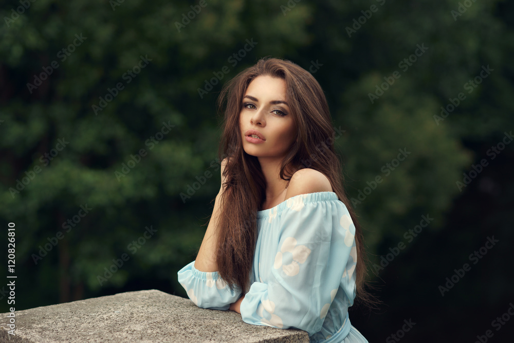 Cute summer portrait of young pretty beautiful woman posing or standing ...