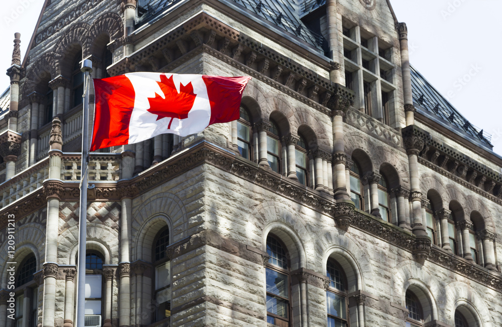 Beautiful Canada flag is waving front of a historical building Stock ...