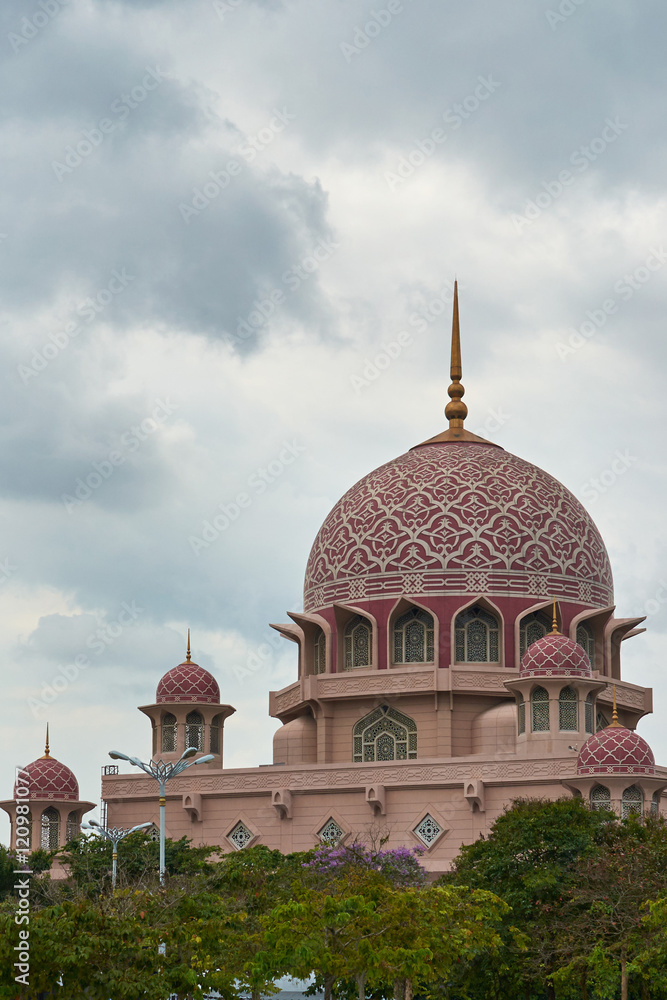 pink mosque in Putrajaya against the cloudy sky , traditional Malaysian ...