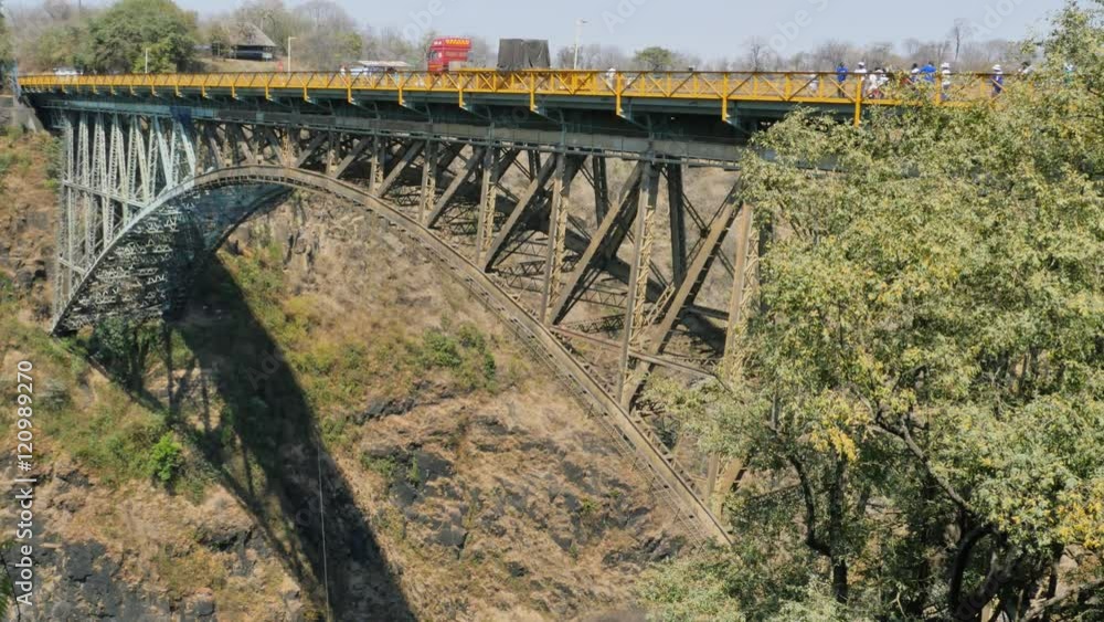 truck and people crossing the victoria falls border bridge that ...