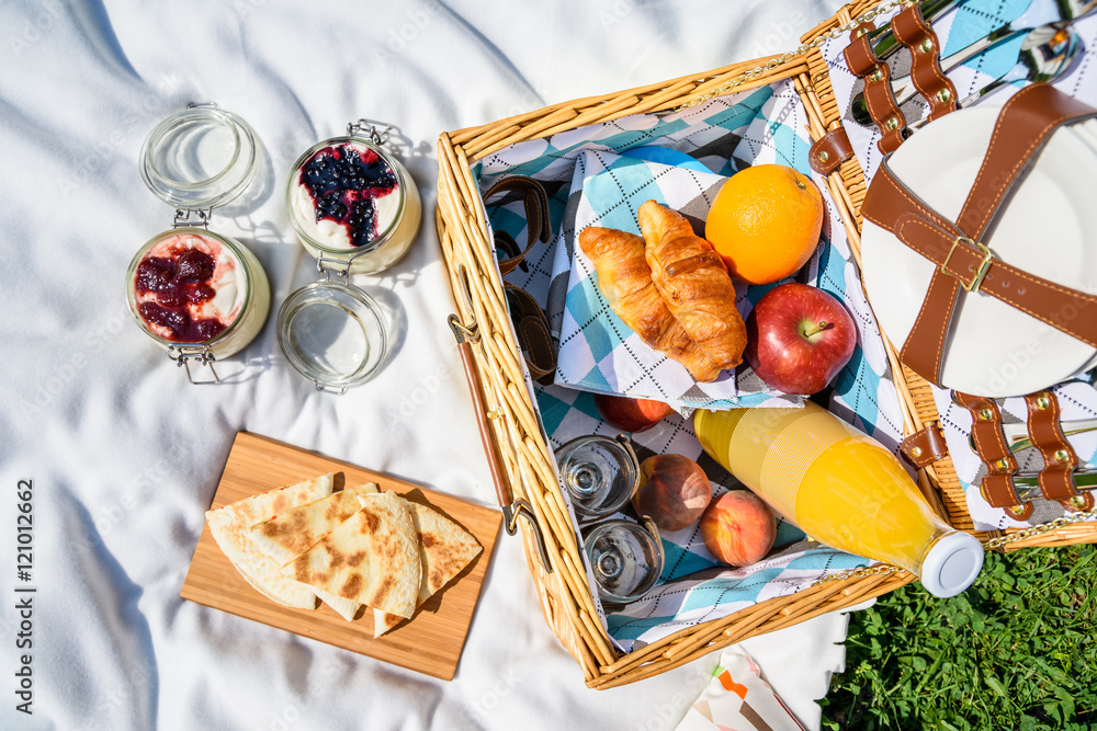 Picnic Basket With Fruits, Orange Juice, Croissants, Quesadilla And No ...