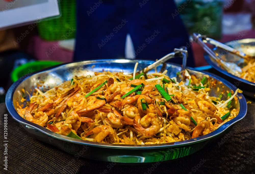 phad Thai is a stir-fried rice noodle dish commonly served as a street ...