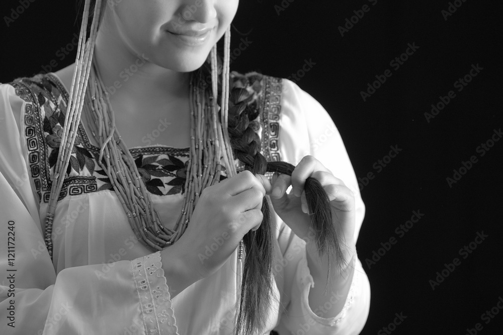 Beautiful young hispanic woman wearing light colored blouse with ...