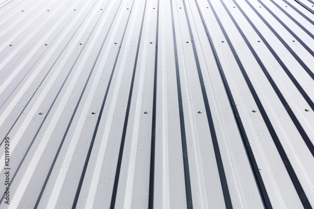 corrugated steel cladding with rivets on roof of industrial building ...