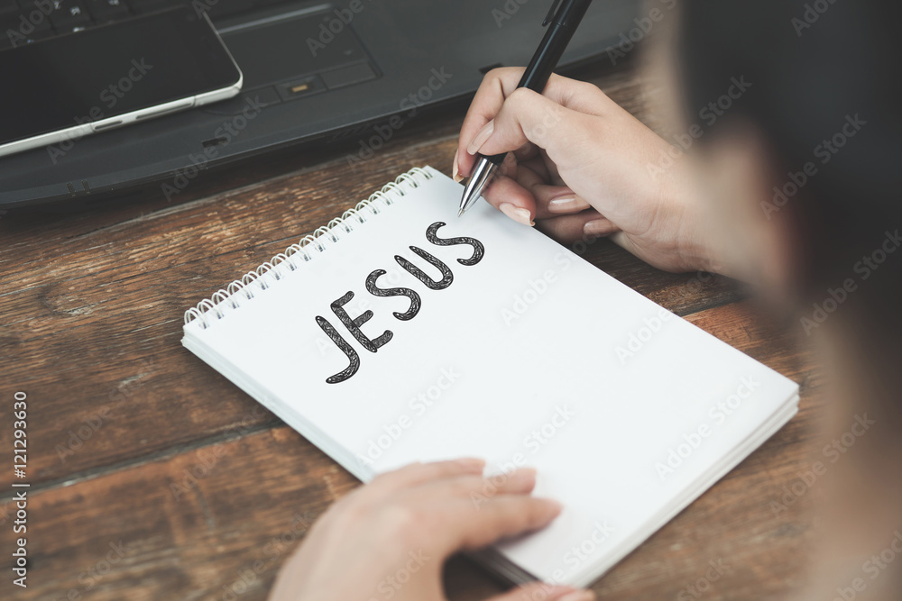 Jesus text on notebook Stock Photo | Adobe Stock