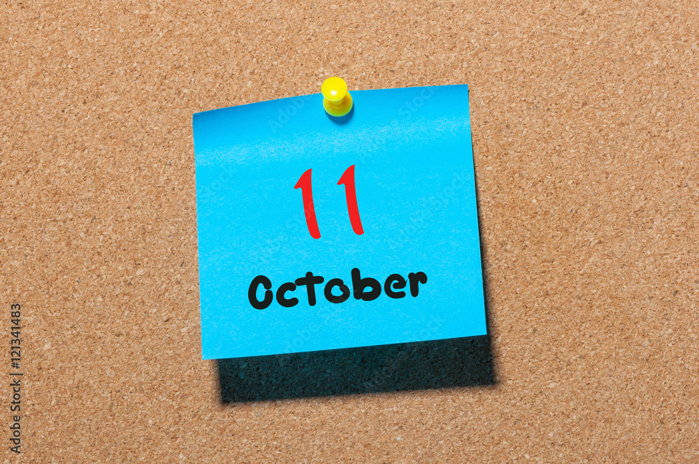 October 11th. Day 11 of month, color sticker calendar on notice board ...