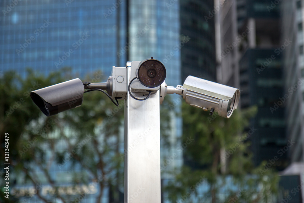 monitoring cameras on the streets of Singapore. Outdoor CCTV in the ...