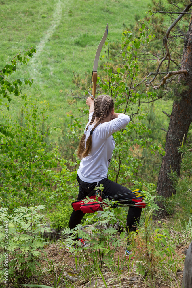 female archer aiming at a target outdoors Stock-Foto | Adobe Stock