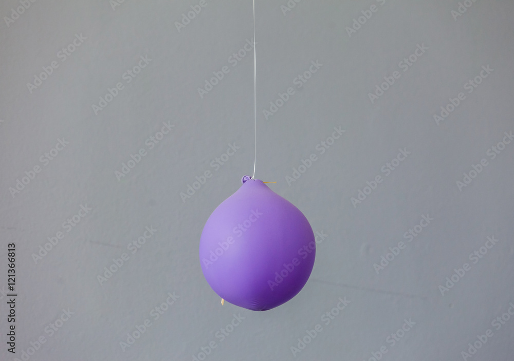 Deflated purple balloon Stock Photo | Adobe Stock