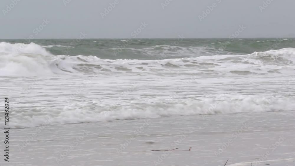Waves crashing onto a beach during a storm. Stock Video | Adobe Stock