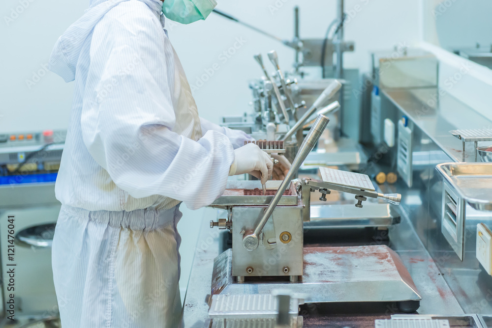 pharmacist preparing medication with packaging capsule in lab Stock ...