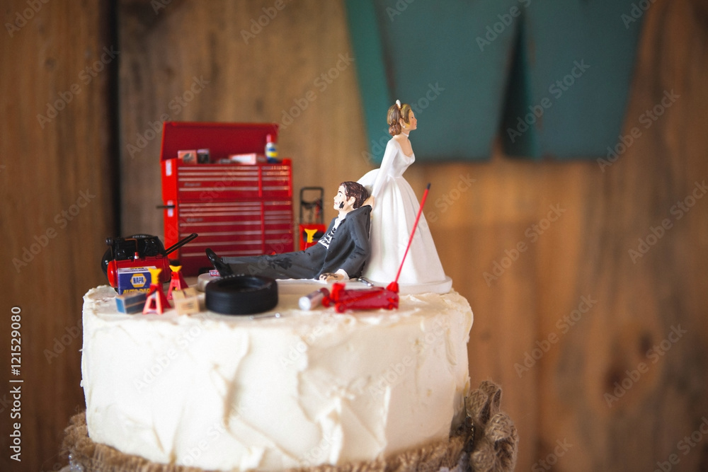 Redneck wedding cake topper with mechanic groom Stock Photo | Adobe Stock