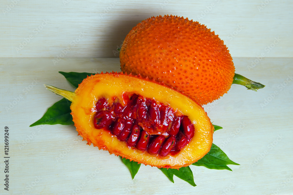 Gac fruit, typical of orange-colored plant foods in Asia with ha Stock ...