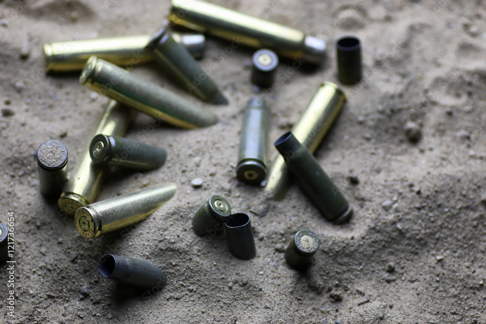 bullet in the sand Stock Photo | Adobe Stock