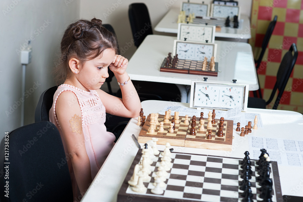 little girl playing chess Stock Photo | Adobe Stock