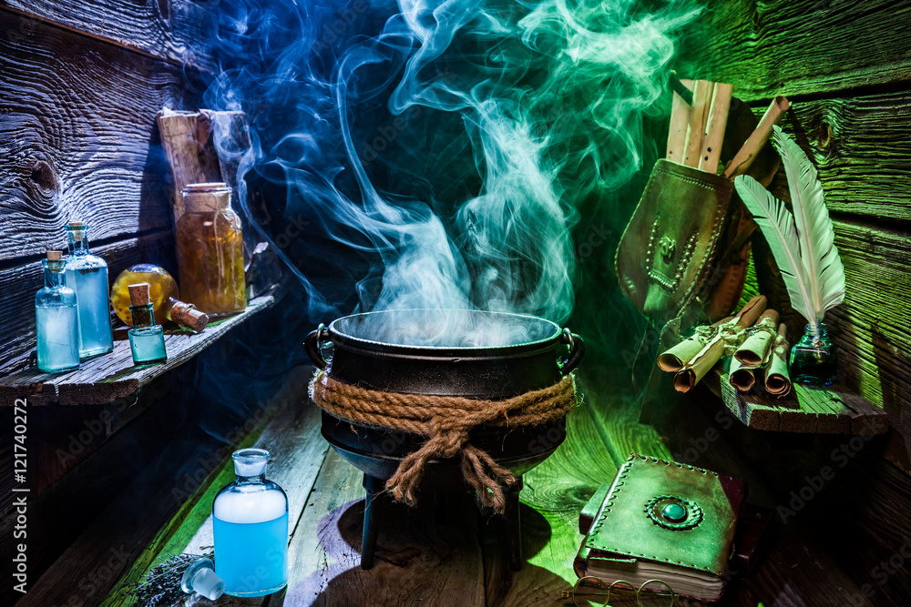 Vintage witch pot with blue and green smoke for Halloween Stock Photo ...