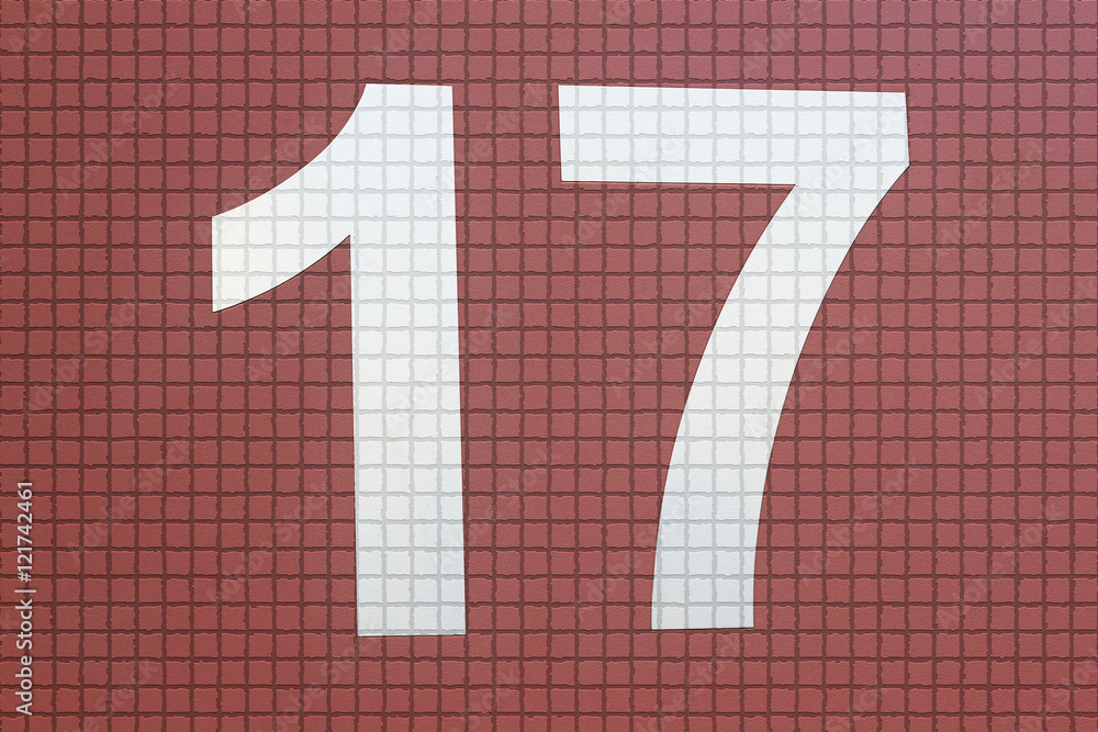 Rótulo de numero 17 en color blanco en pared Stock Photo | Adobe Stock