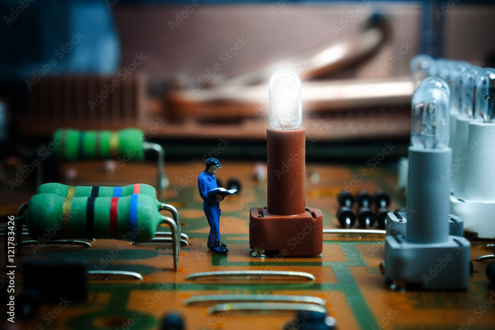 Miniature electrician model on curcuit board with lamp Stock Photo ...