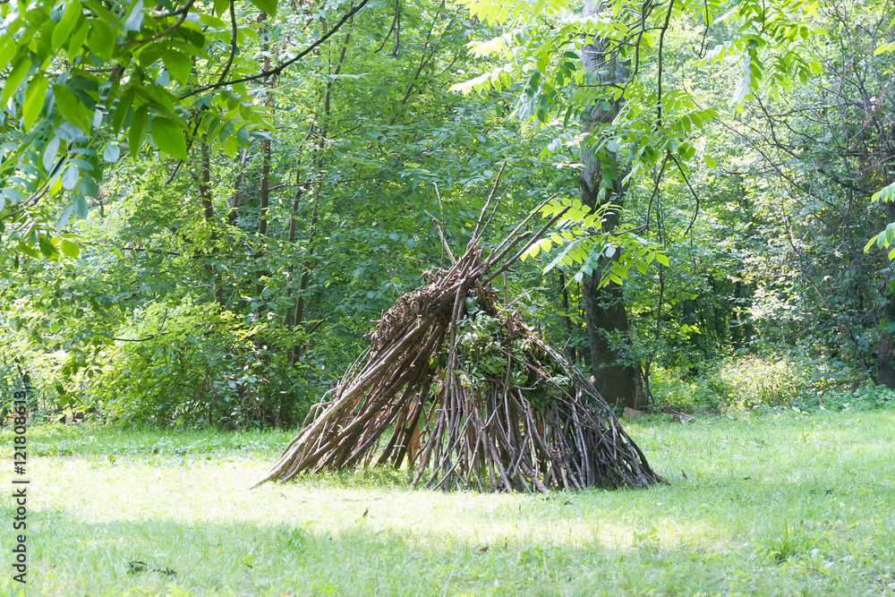 kids playing next to wooden stick house looking like indian hut, Stock ...