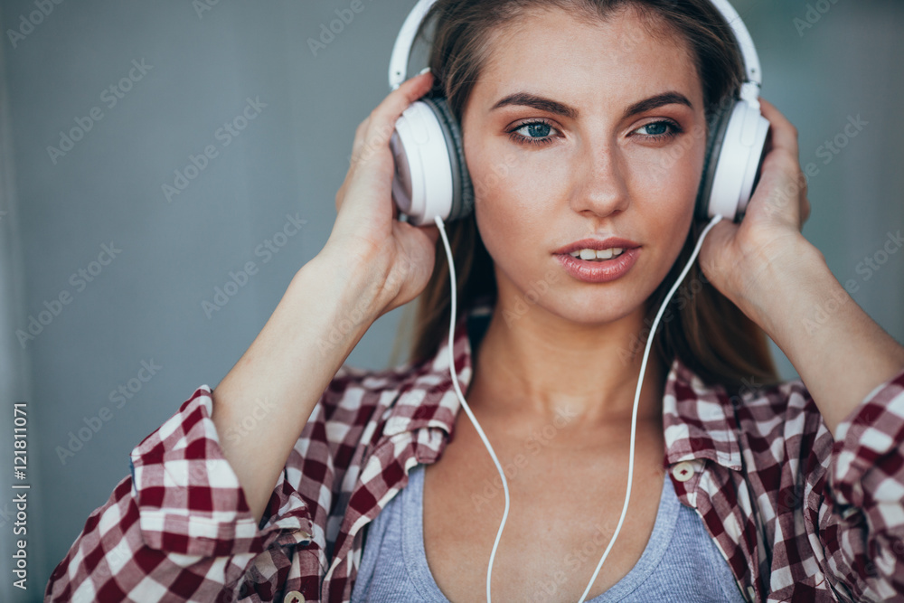 beautiful girl portrait wearing headphones. Stock Photo | Adobe Stock