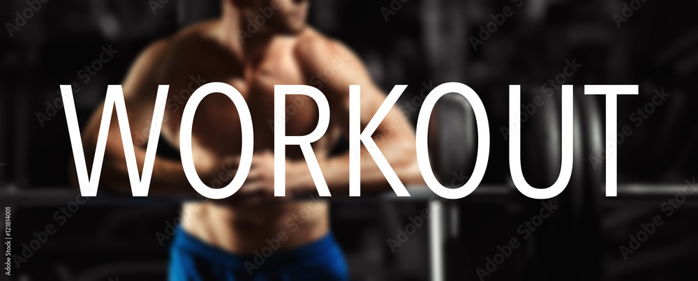 The word WORKOUT in the blurry background bodybuilder in the gym. Stock ...